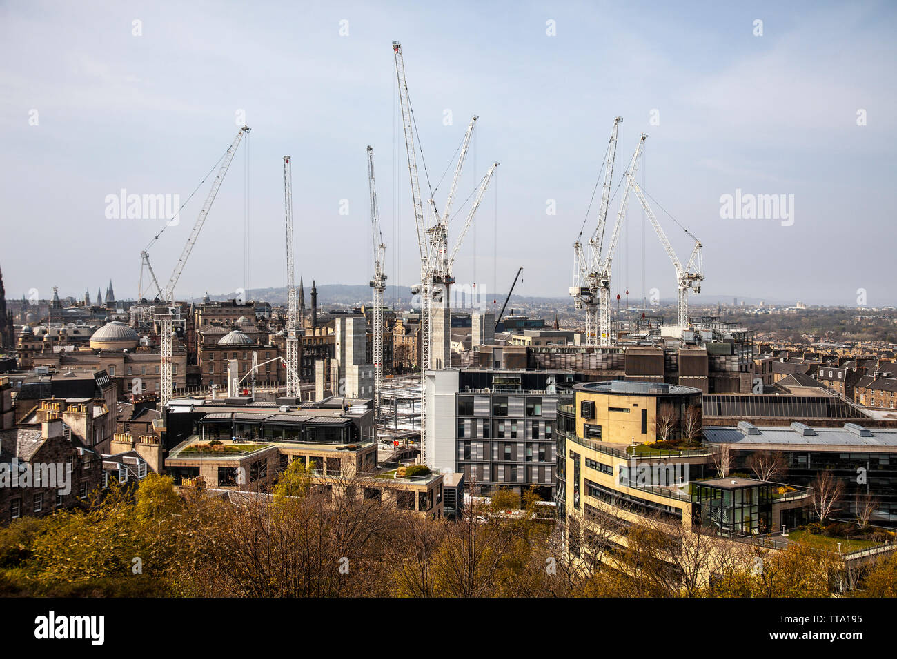 Construction cranes at work on the Edinburgh St James project, a retail ...