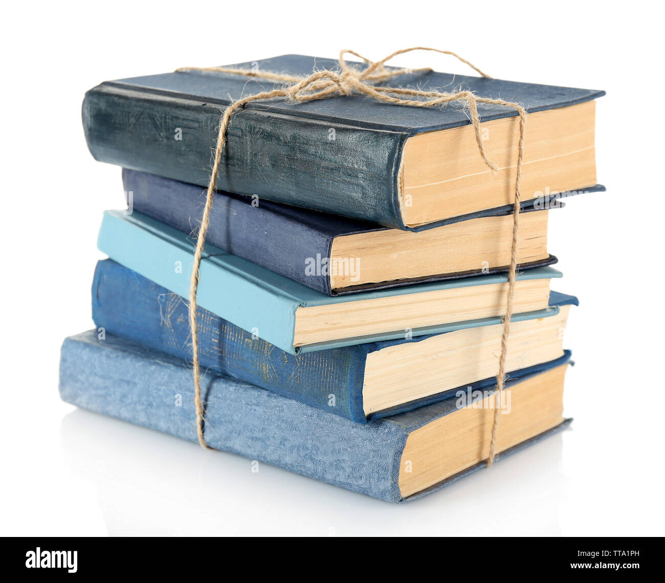 Stack of tied books isolated on white Stock Photo - Alamy