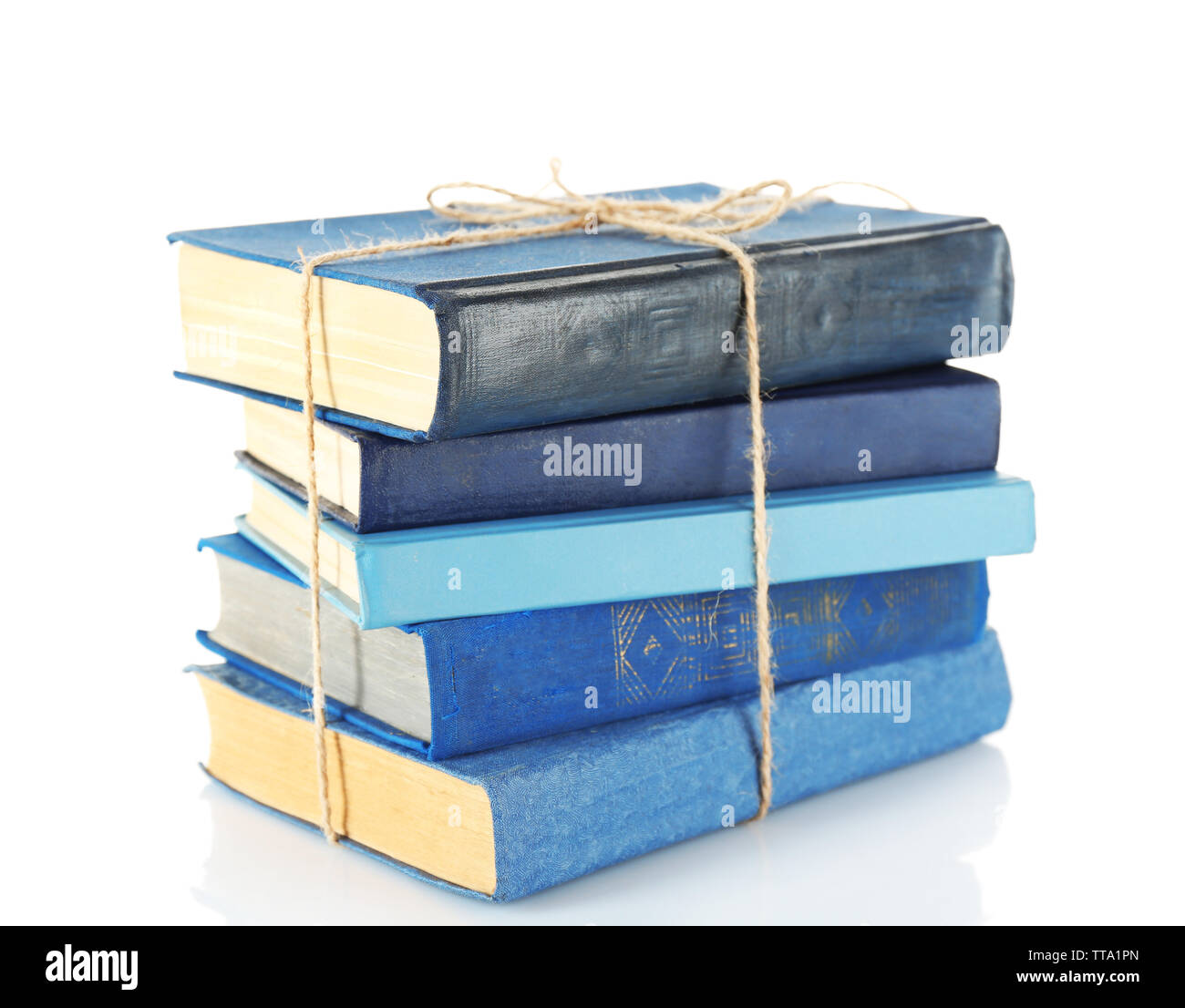 Stack of tied books isolated on white Stock Photo - Alamy