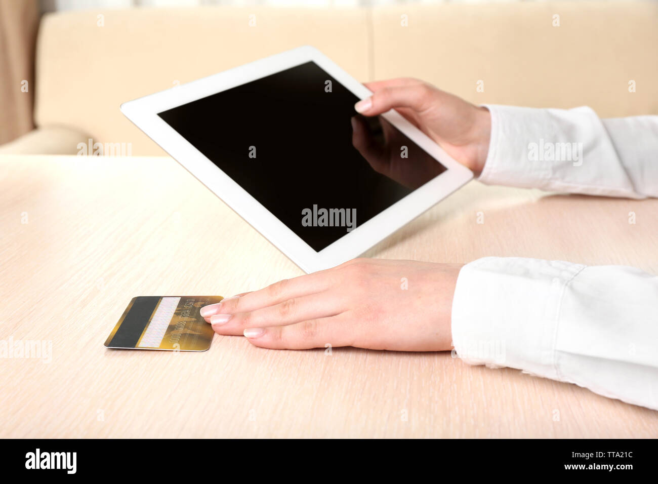 Female hands with tablet and credit card as online shopping concept ...