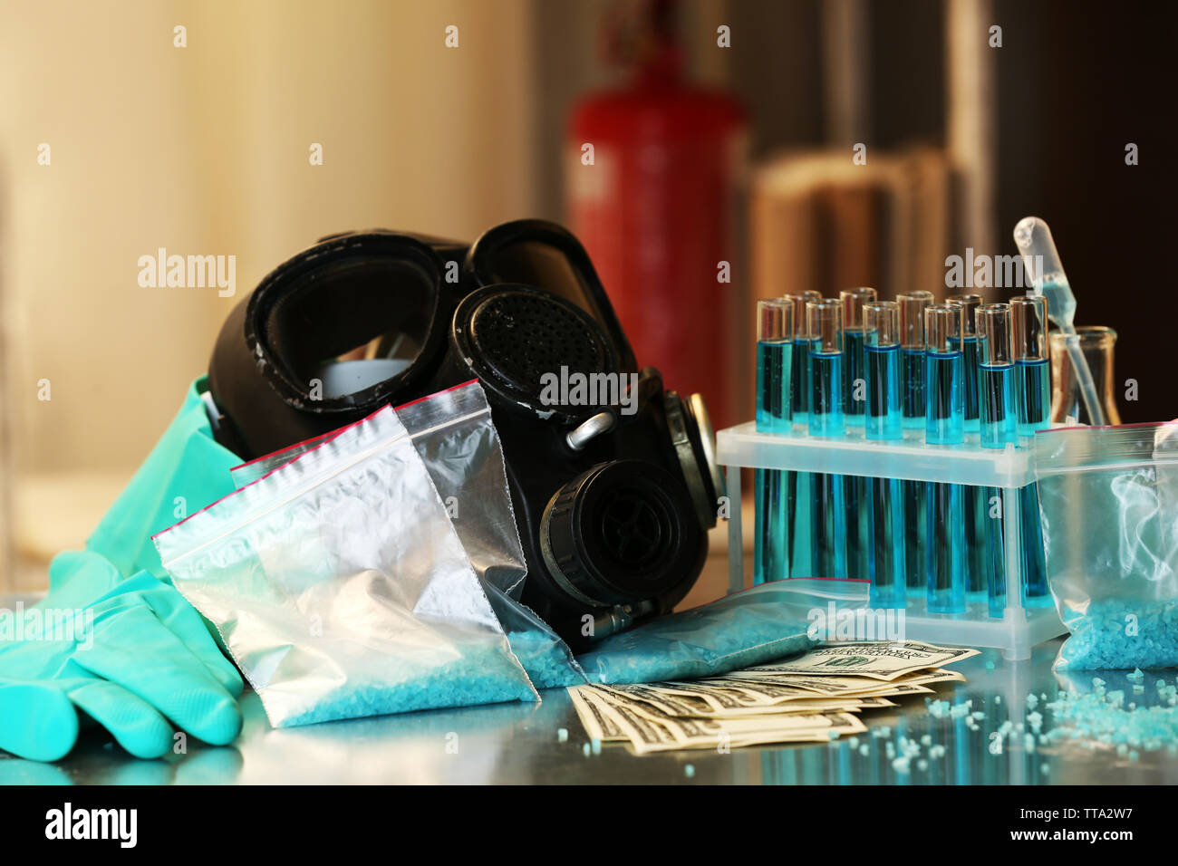 Drug laboratory: blue methamphetamine and money on table close up Stock ...