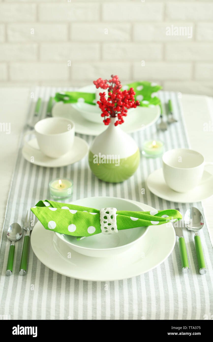 Beautiful holiday table setting in white and green color Stock Photo ...