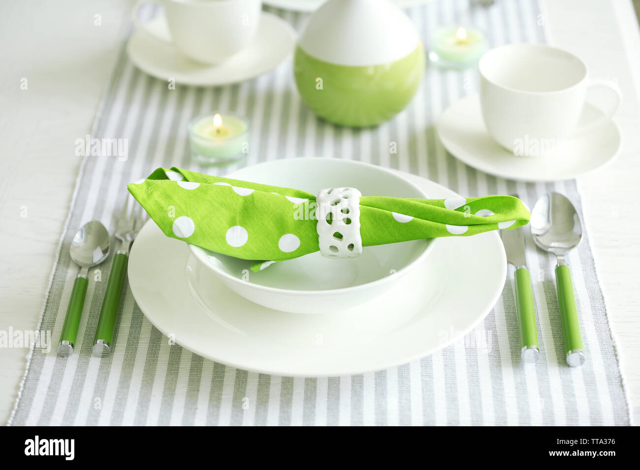 Beautiful holiday table setting in white and green color Stock Photo ...