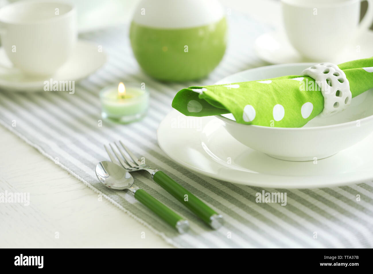 Beautiful holiday table setting in white and green color Stock Photo ...
