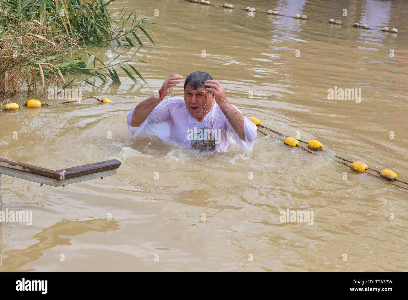 BETHABARA, ISRAEL- 25 NOVEMBER 2017: Pilgrims from different countries ...