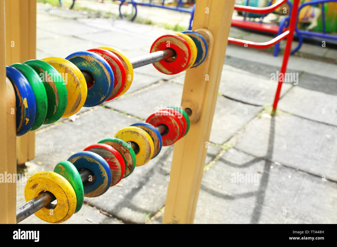 Colorful wooden rings for count on playground Stock Photo - Alamy