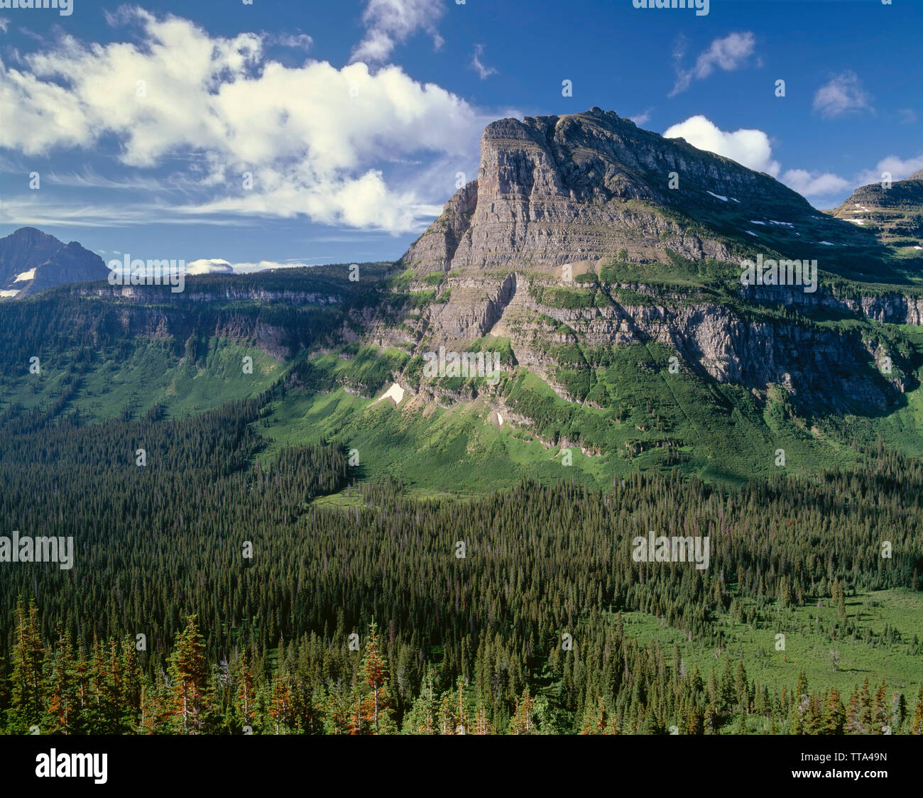 USA, Montana, Glacier National Park, Heavy Runner Mountain rises above ...
