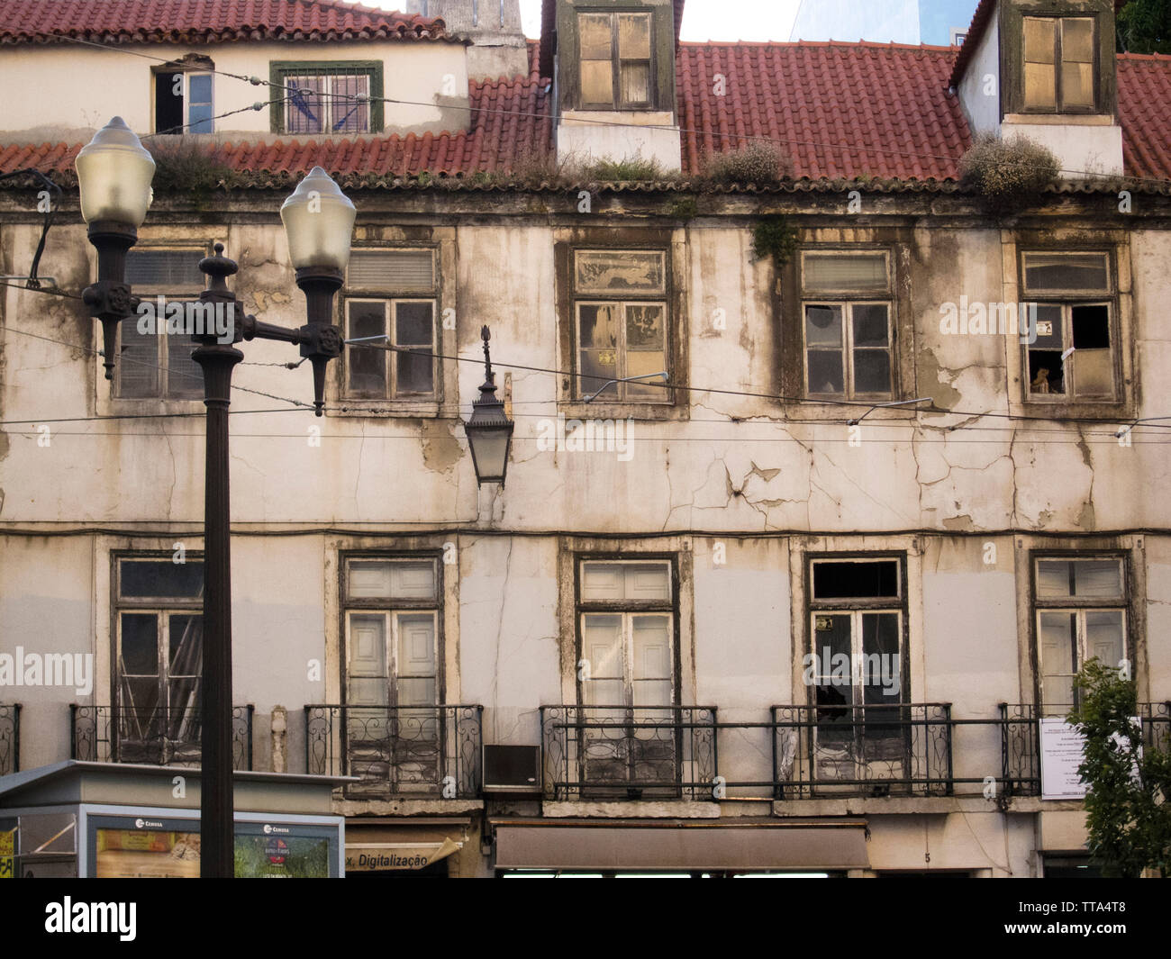 Neglected building in a commercial neighborhood of Lisbon, Portugal ...