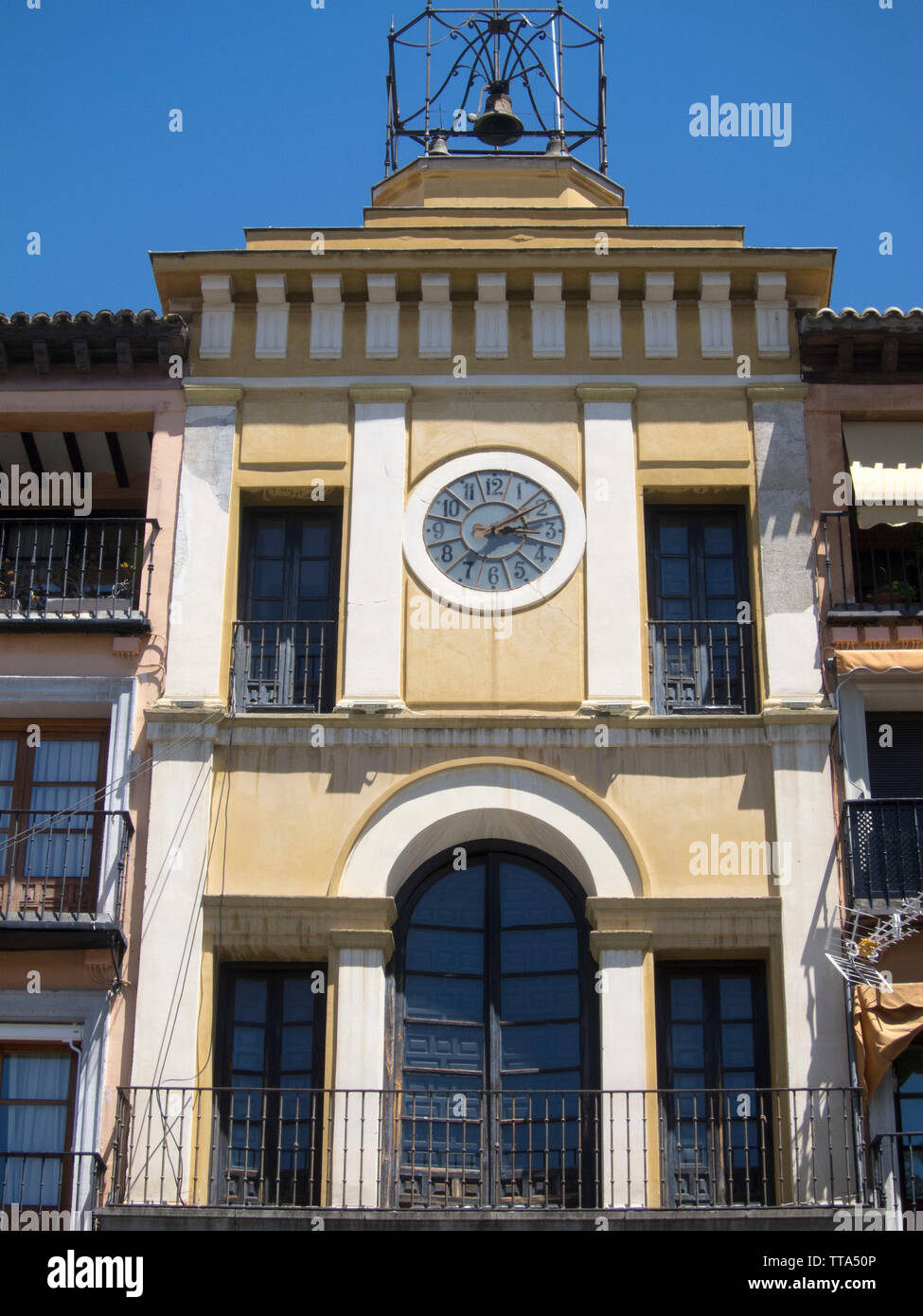 Clock tower facing town square in Toledo, Spain Stock Photo - Alamy