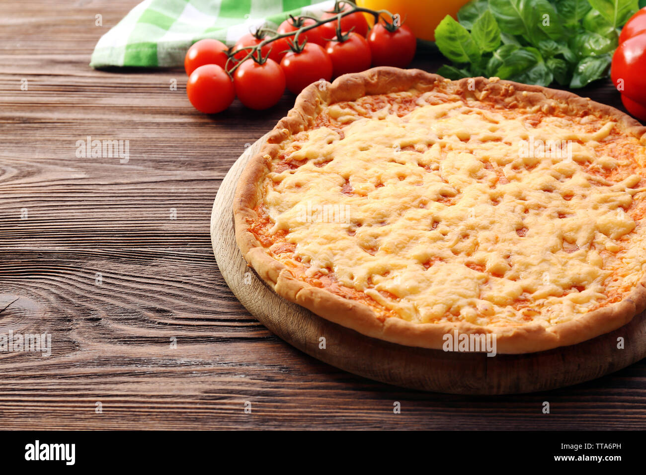 Cheese pizza with vegetables on table close up Stock Photo - Alamy