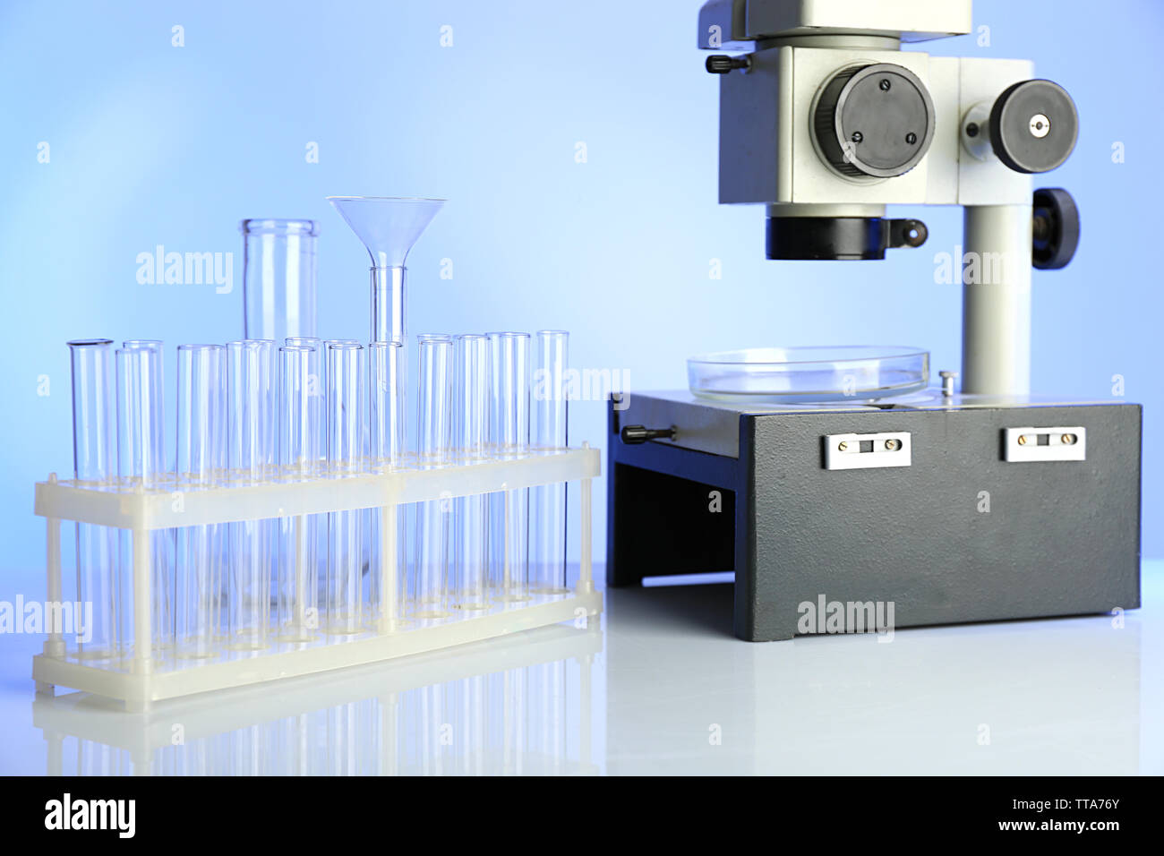 Test tubes and microscope in laboratory Stock Photo - Alamy