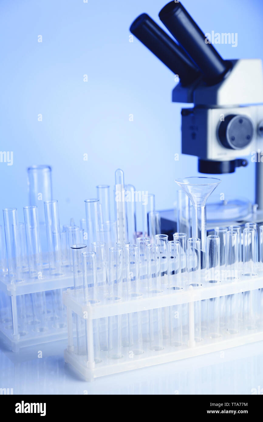 Test tubes and microscope in laboratory Stock Photo - Alamy