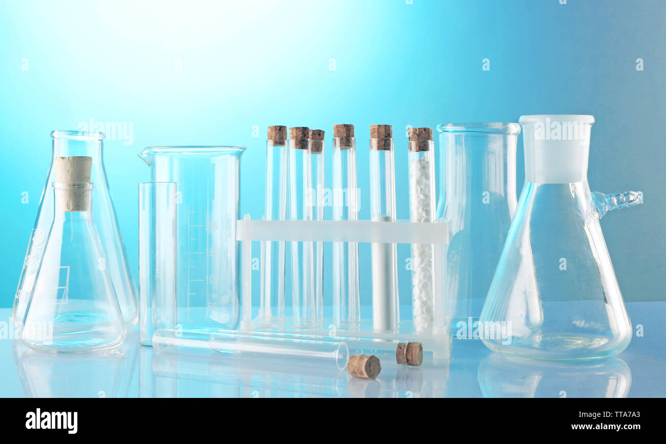 Empty laboratory test tubes on blue background Stock Photo - Alamy