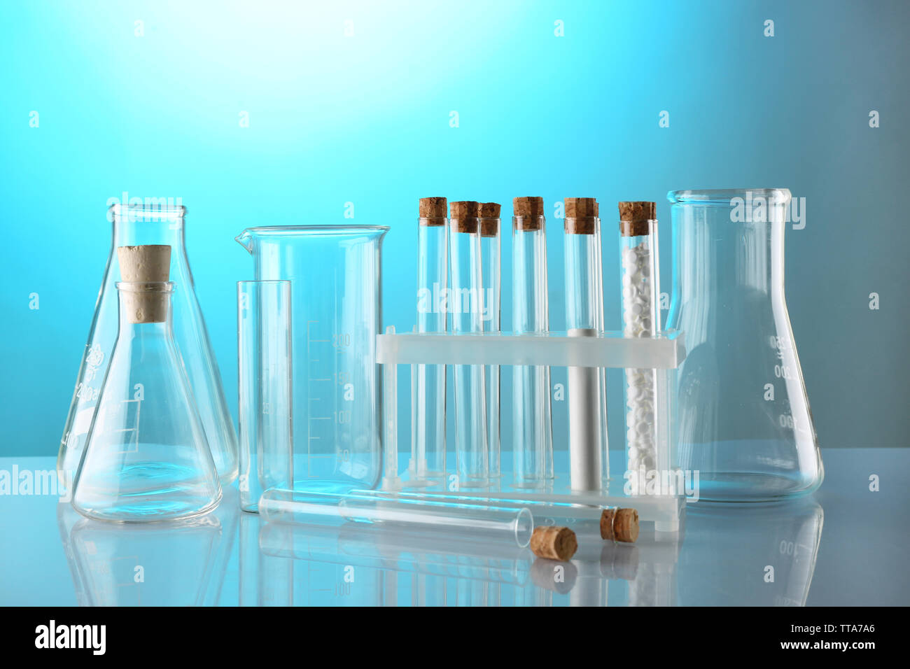 Empty laboratory test tubes on blue background Stock Photo - Alamy