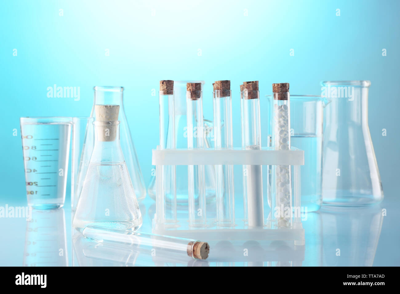 Empty laboratory test tubes on blue background Stock Photo - Alamy