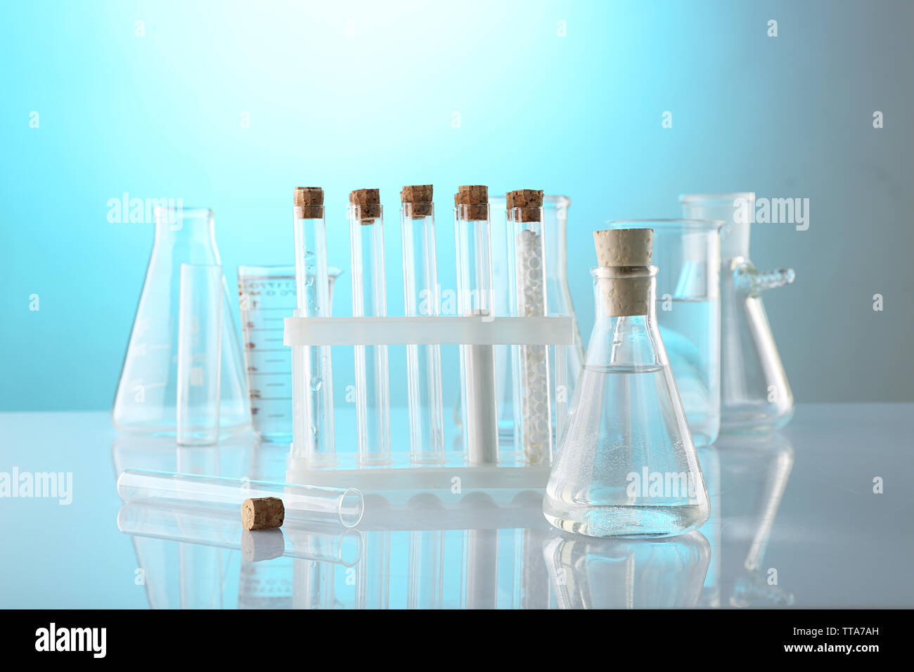 Empty laboratory test tubes on blue background Stock Photo - Alamy