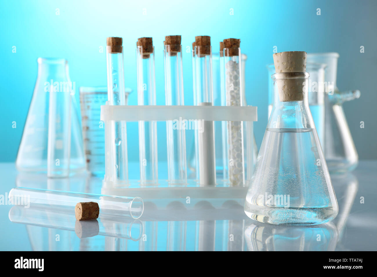 Empty laboratory test tubes on blue background Stock Photo - Alamy