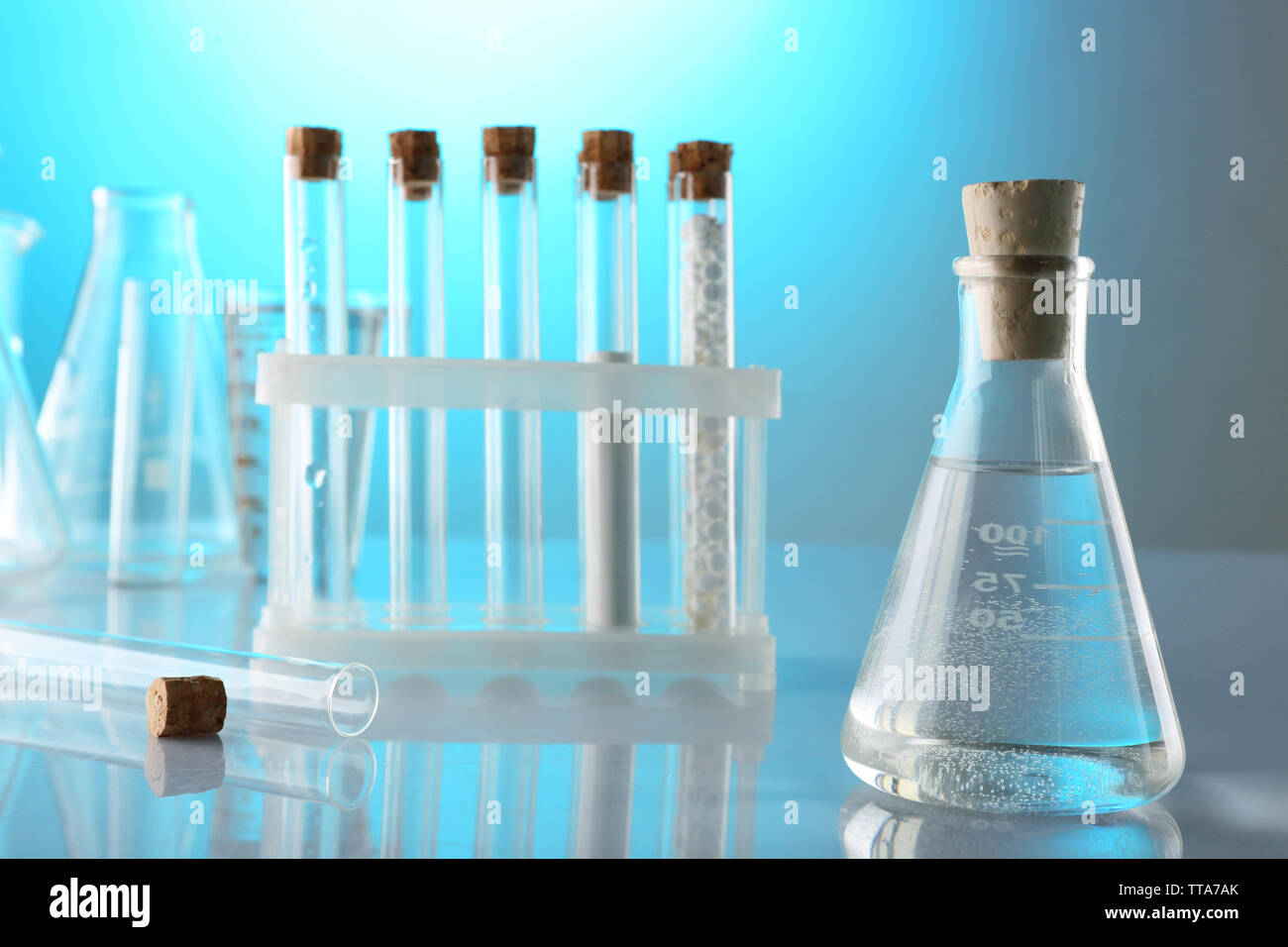 Empty laboratory test tubes on blue background Stock Photo - Alamy