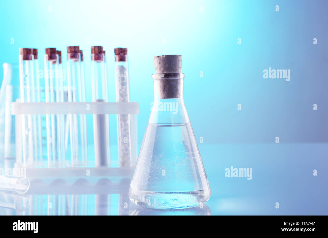 Empty laboratory test tubes on blue background Stock Photo - Alamy