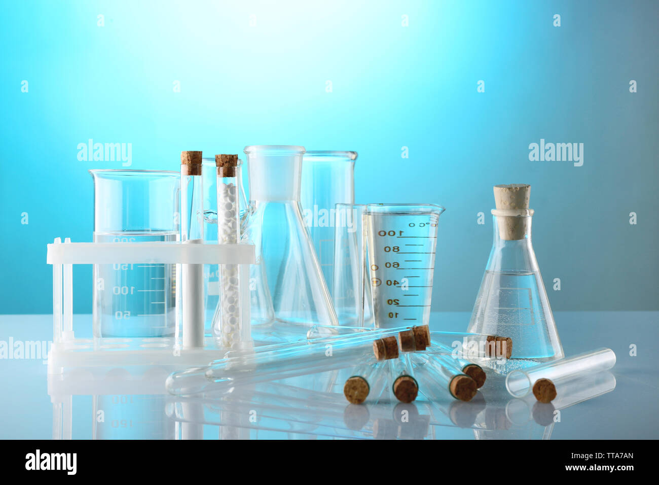 Empty laboratory test tubes on blue background Stock Photo - Alamy