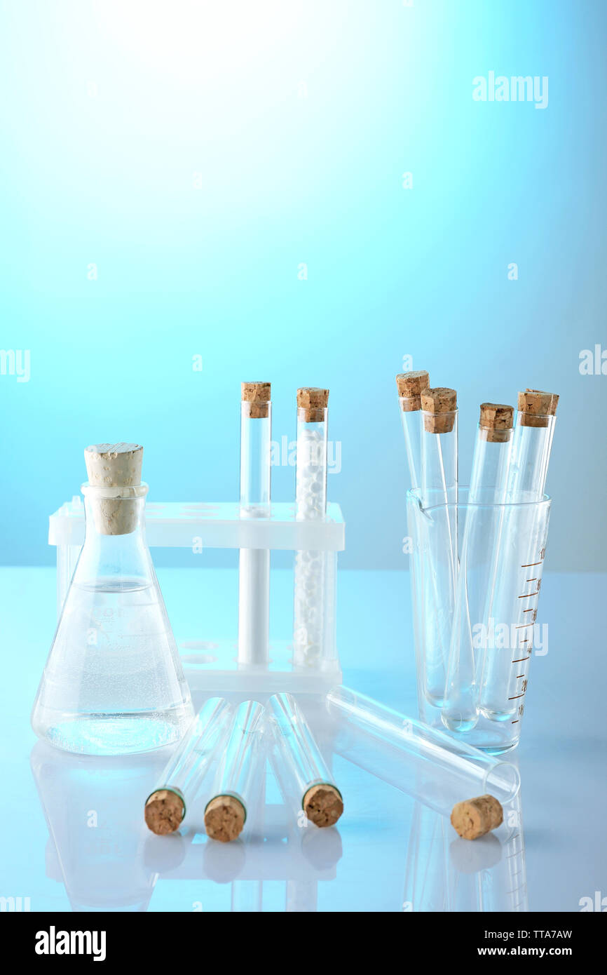 Empty laboratory test tubes on blue background Stock Photo - Alamy