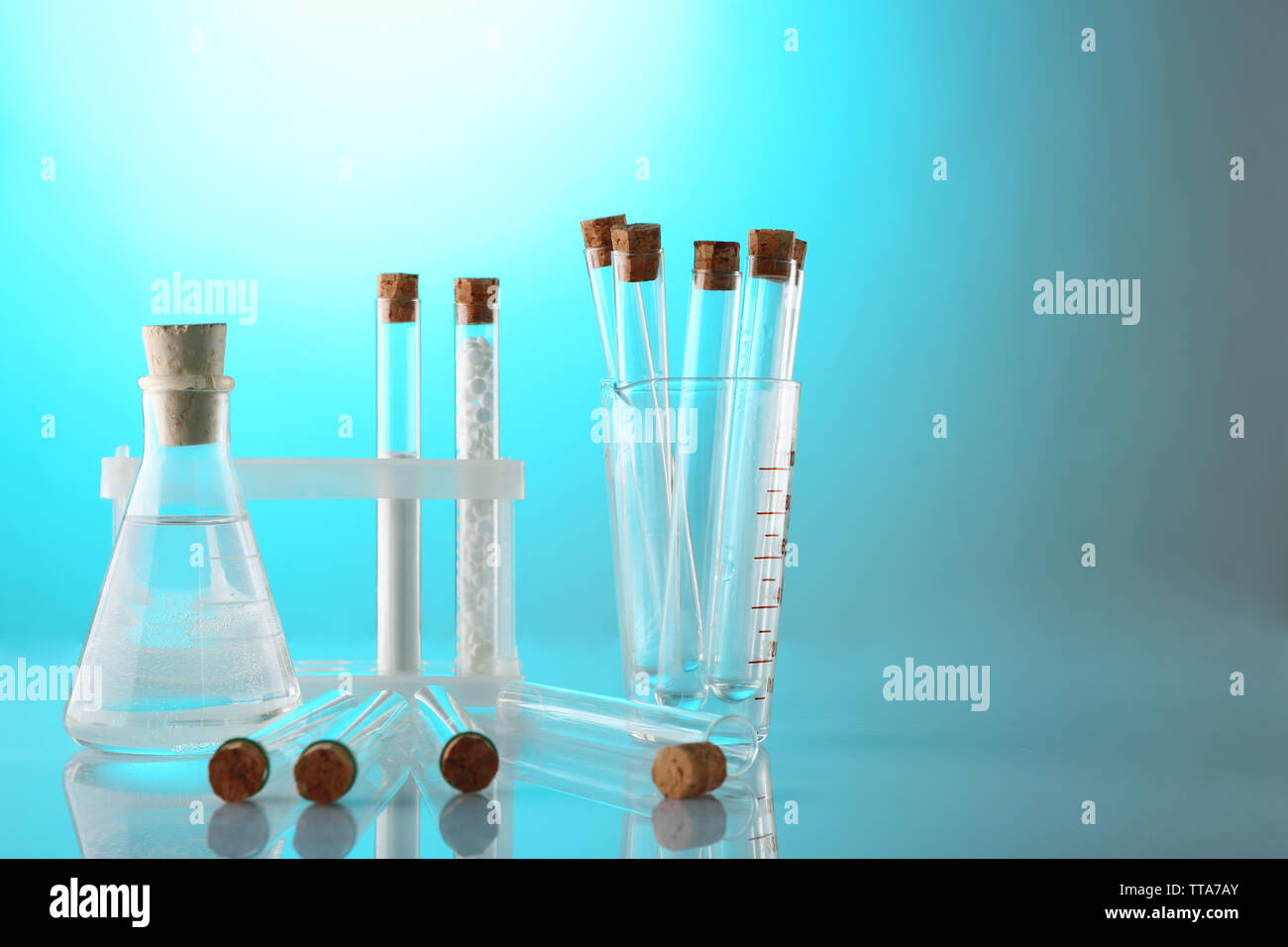 Empty laboratory test tubes on blue background Stock Photo - Alamy