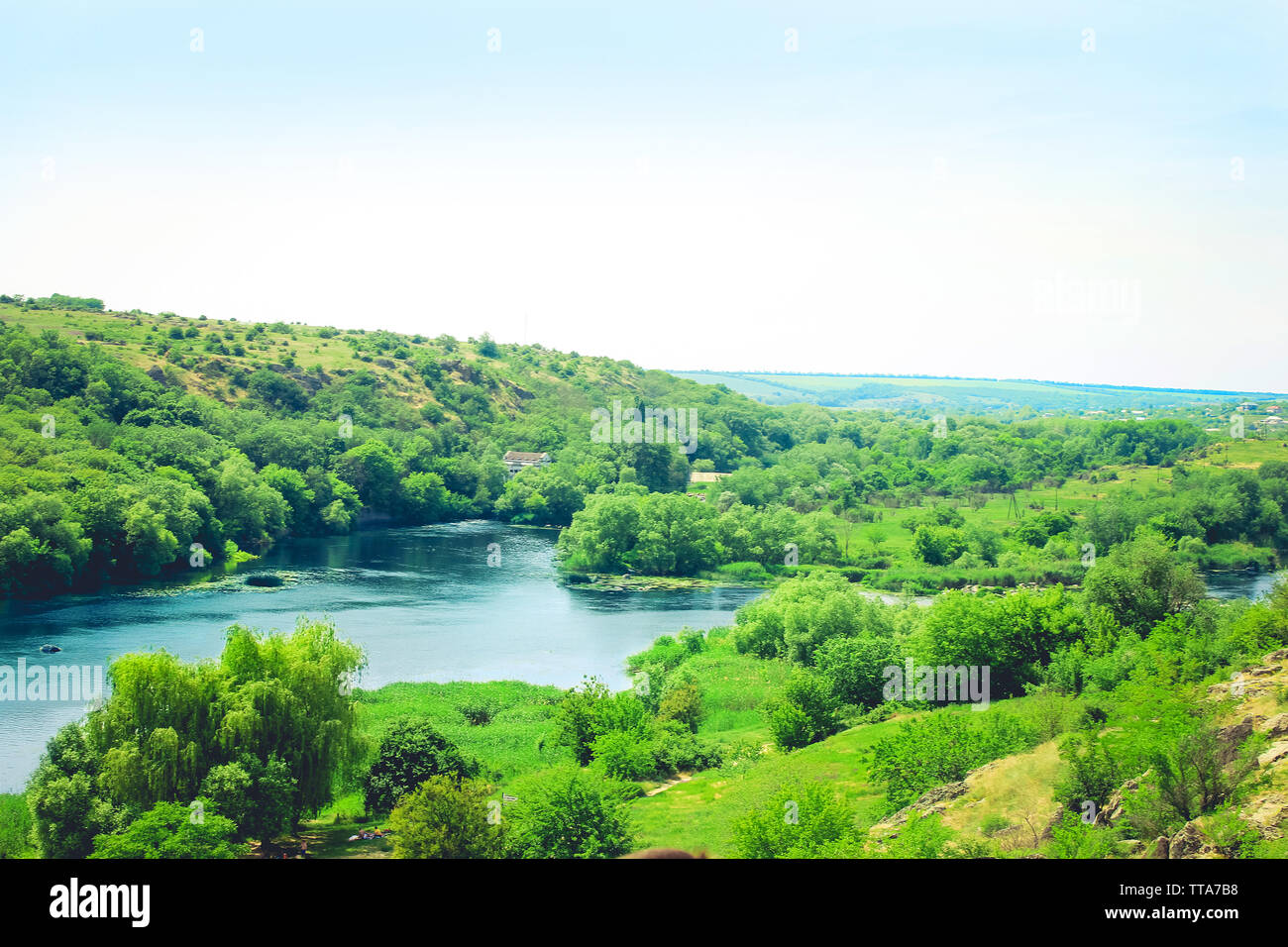 River bank over blue sky background Stock Photo - Alamy
