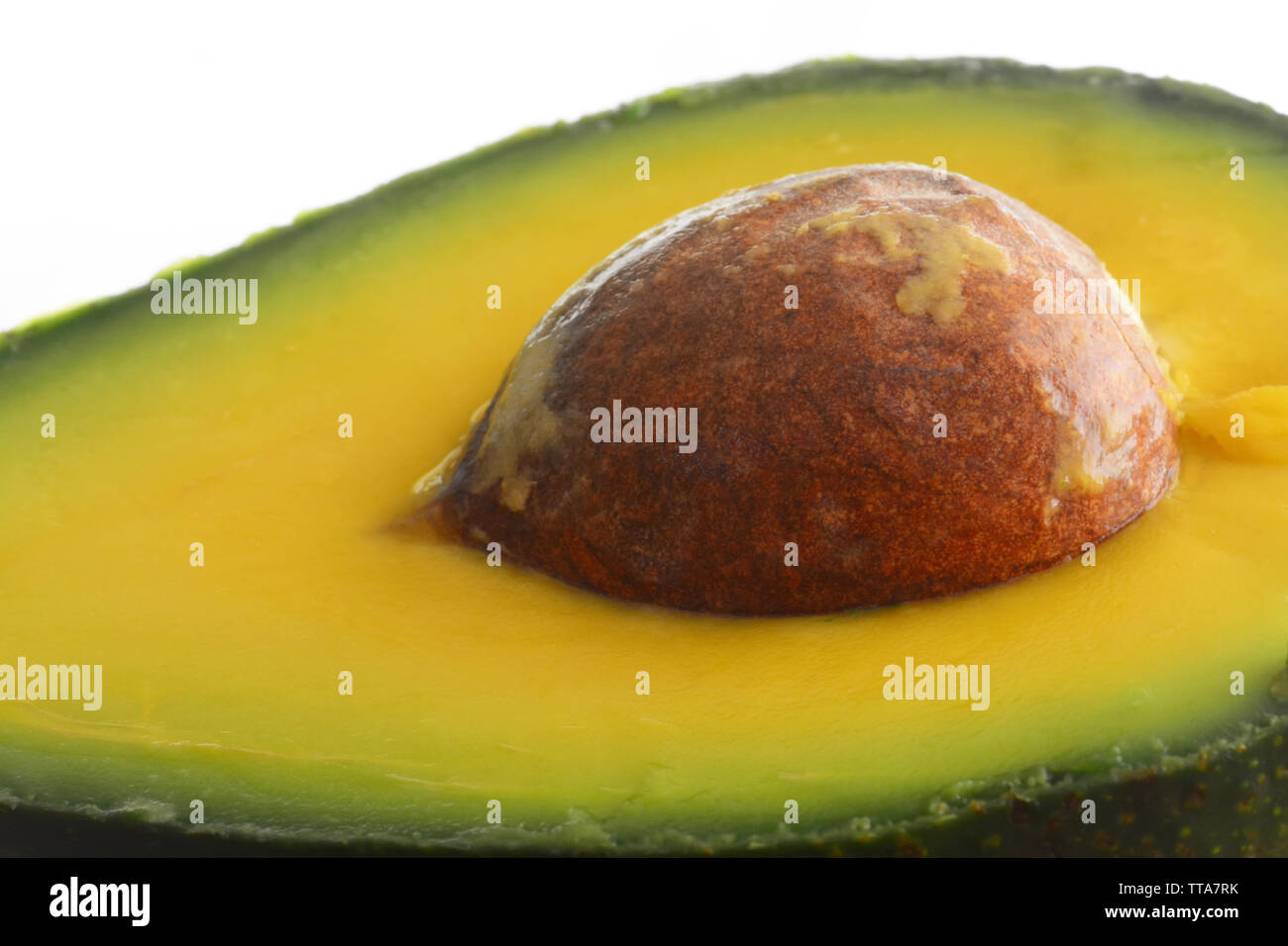 Half avocado in closeup Stock Photo - Alamy