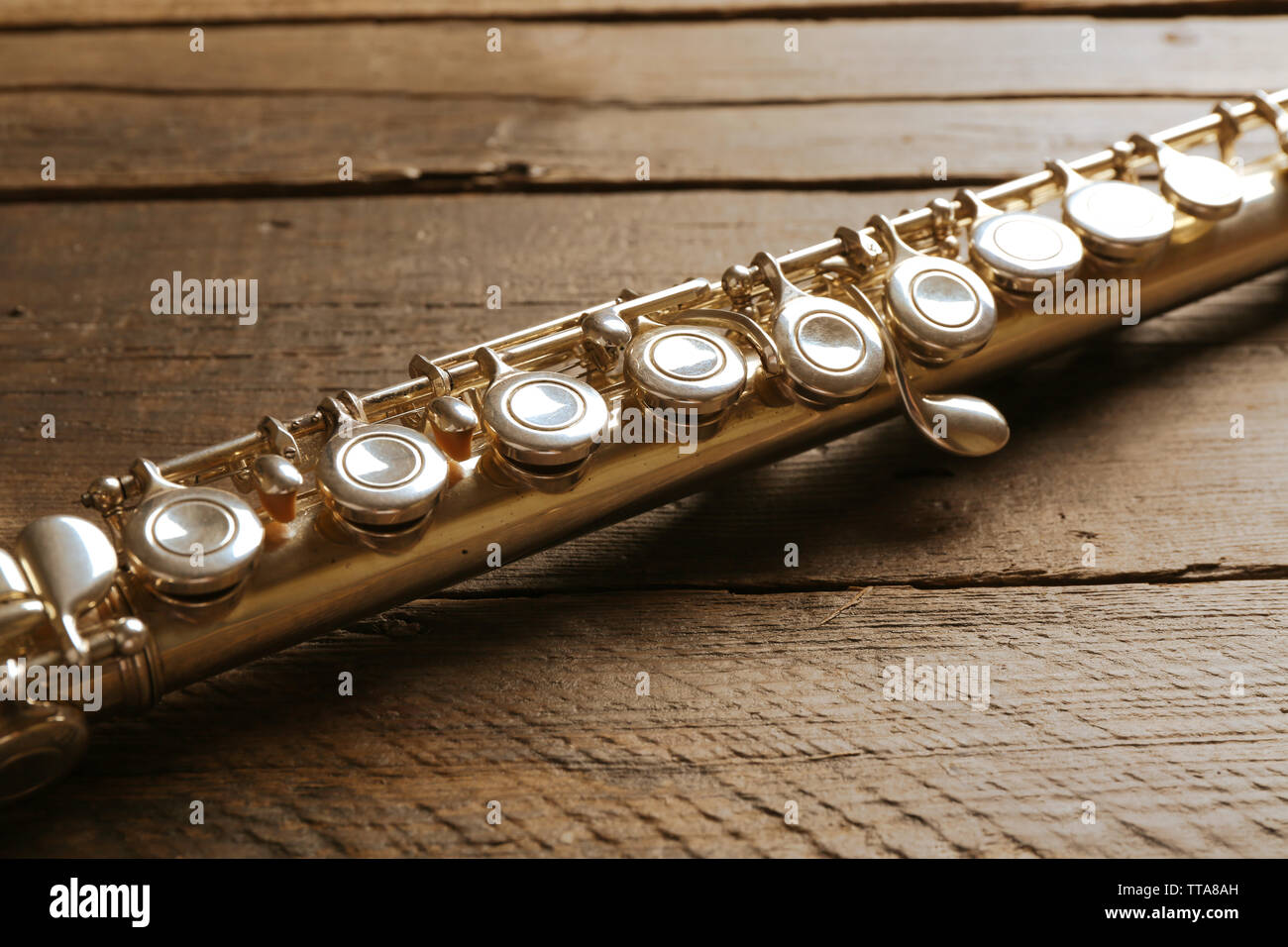 Flute on wooden background Stock Photo - Alamy