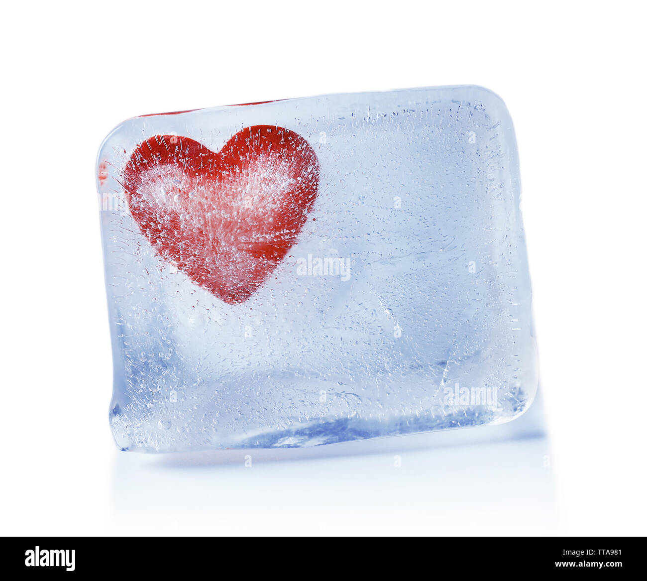 Red heart in ice cube on gray background Stock Photo - Alamy