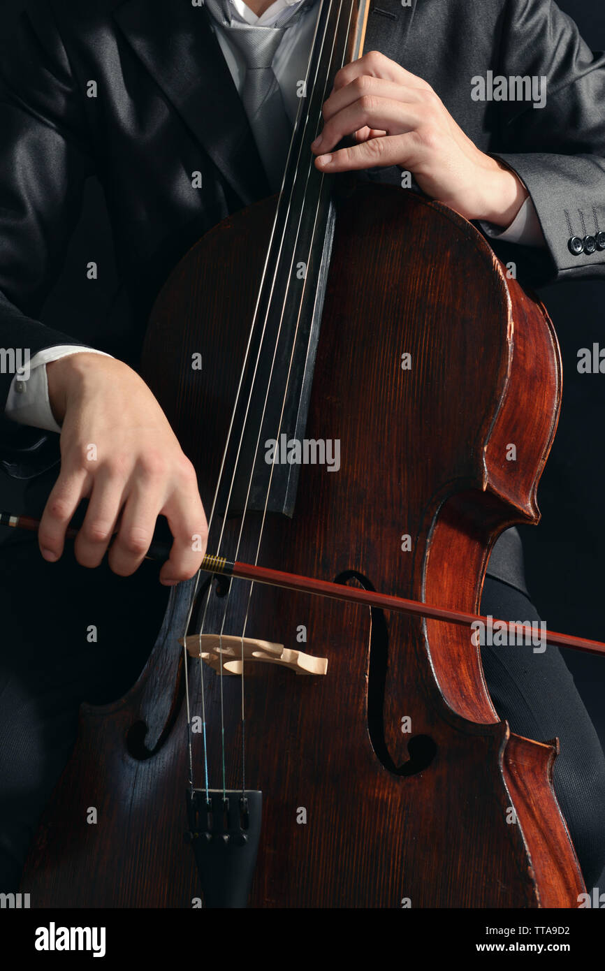 Man playing on cello close up Stock Photo - Alamy