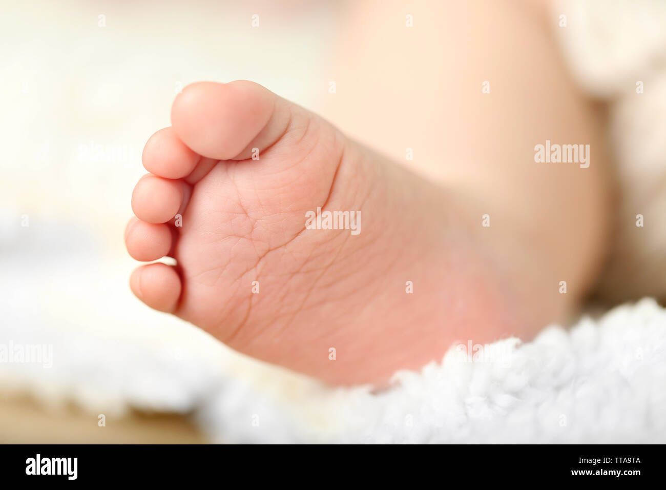 Baby foot, closeup Stock Photo - Alamy