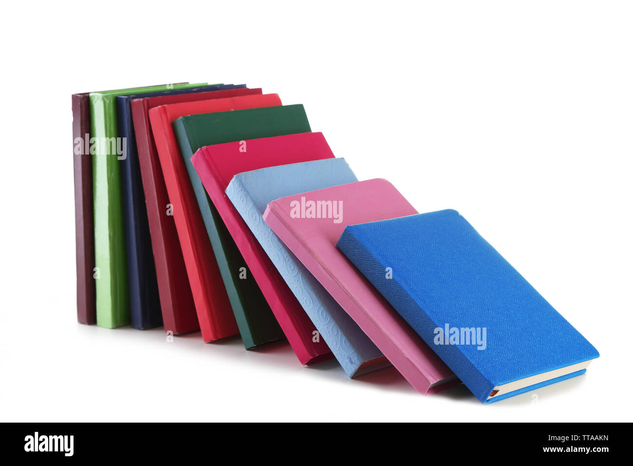 Falling books isolated on white Stock Photo - Alamy