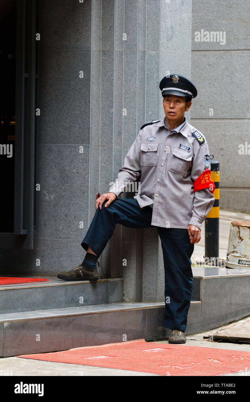 30 July 2016-Kunming/China- Security guard stands on the street Stock ...