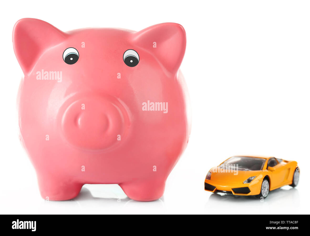 Piggy bank with toy car isolated on white Stock Photo - Alamy