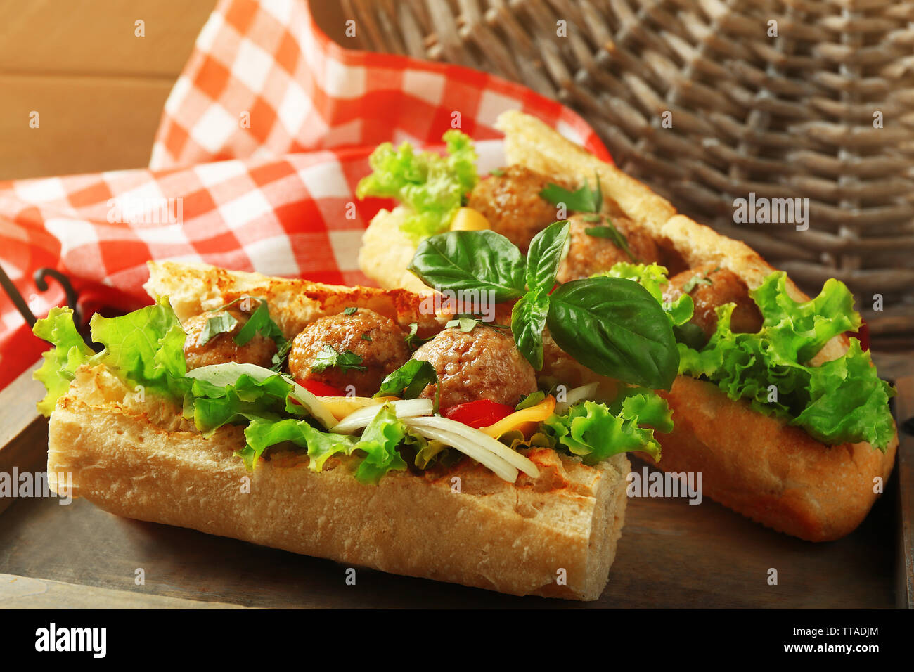 Homemade Spicy Meatball Sub Sandwich on tray, on wooden table ...