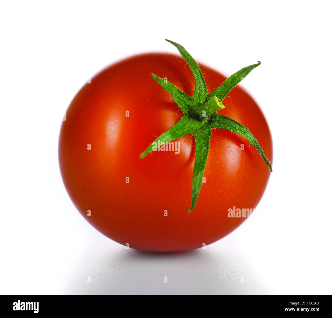 Single cherry tomato isolated on white Stock Photo - Alamy