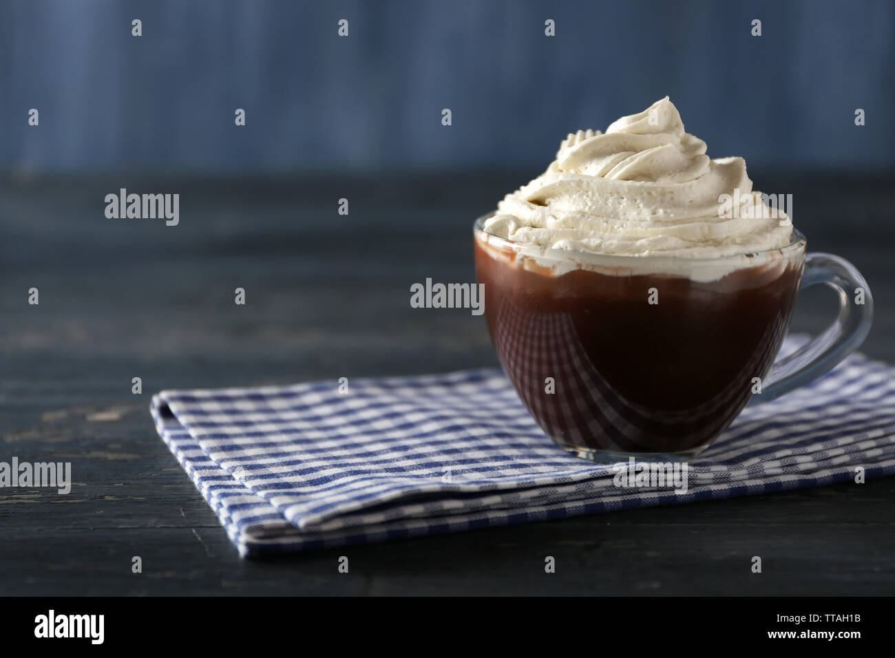 Cup of coffee with cream on color wooden background Stock Photo - Alamy