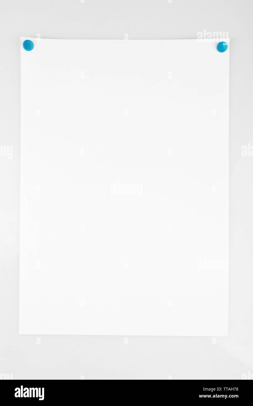 White sheet of paper attached on white background Stock Photo - Alamy
