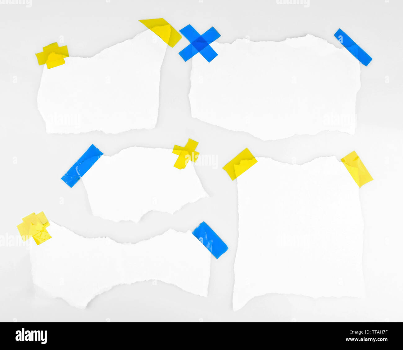 White pieces of paper attached on white background Stock Photo - Alamy