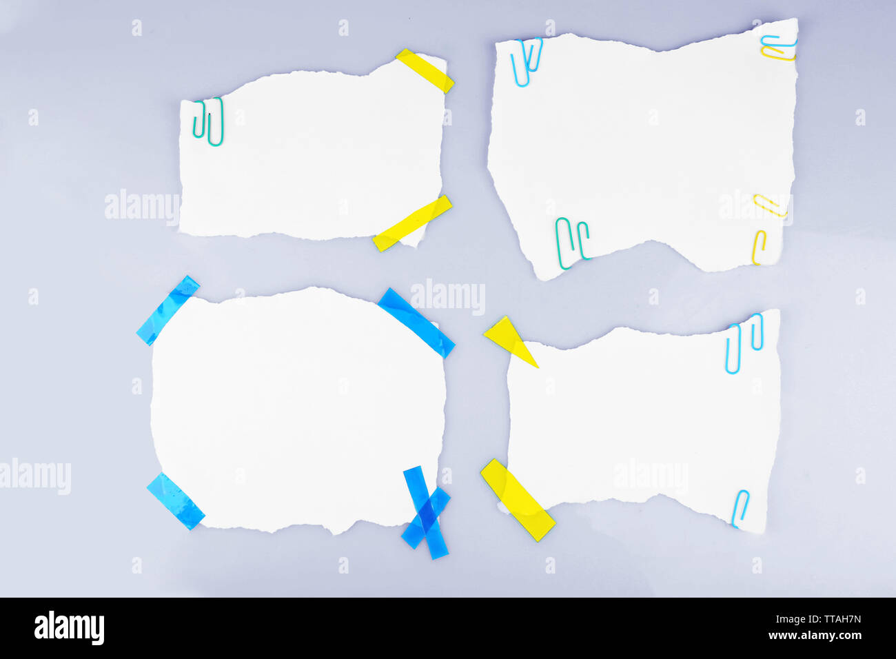 White pieces of paper attached on white background Stock Photo - Alamy