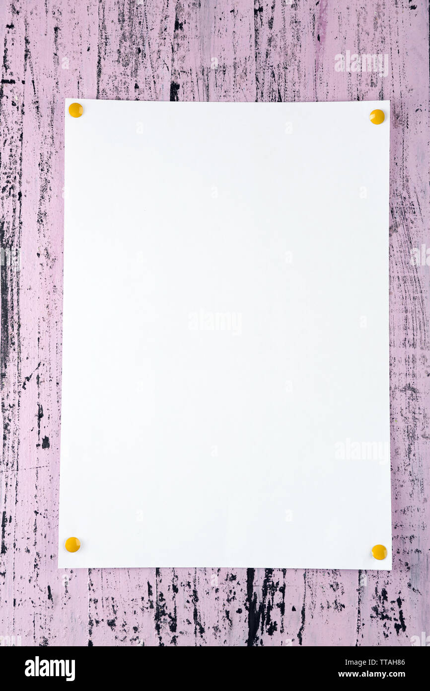 White sheet of paper attached on purple wooden background Stock Photo ...