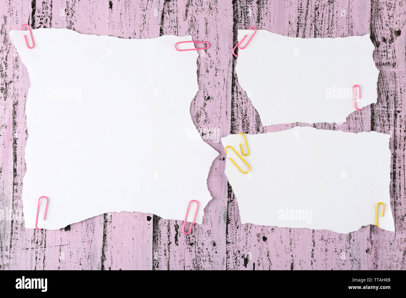 White pieces of paper attached on purple wooden background Stock Photo ...