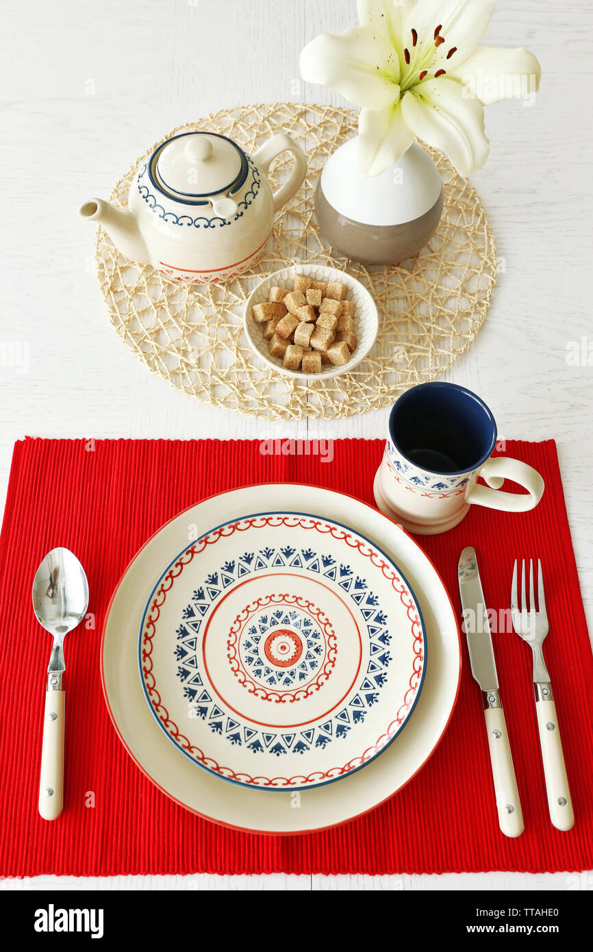 Table setting with red napkin Stock Photo - Alamy