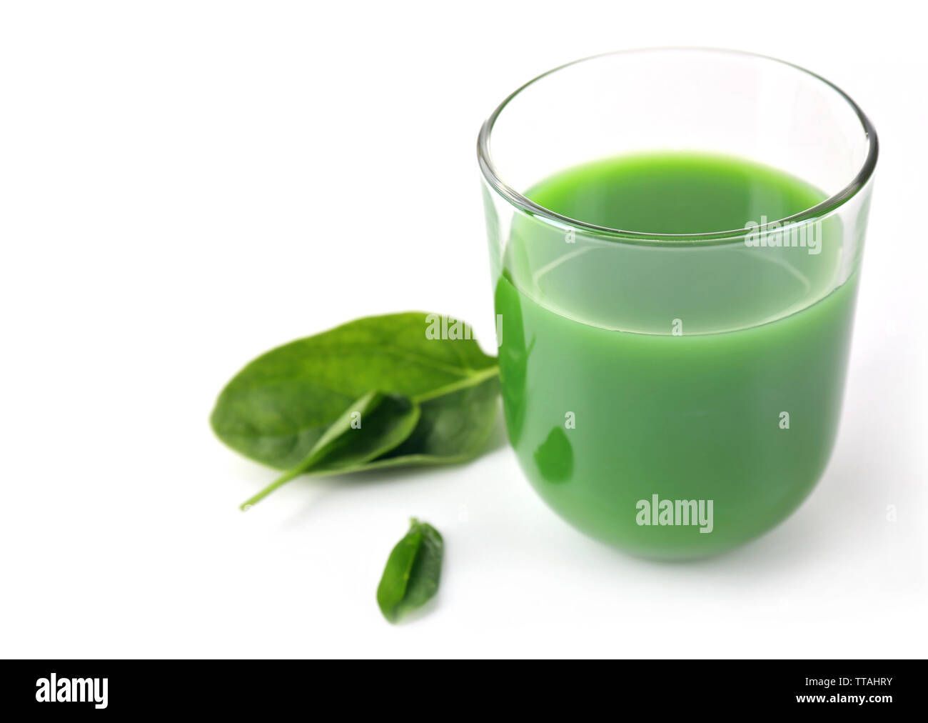 Glass of spinach juice isolated on white Stock Photo - Alamy