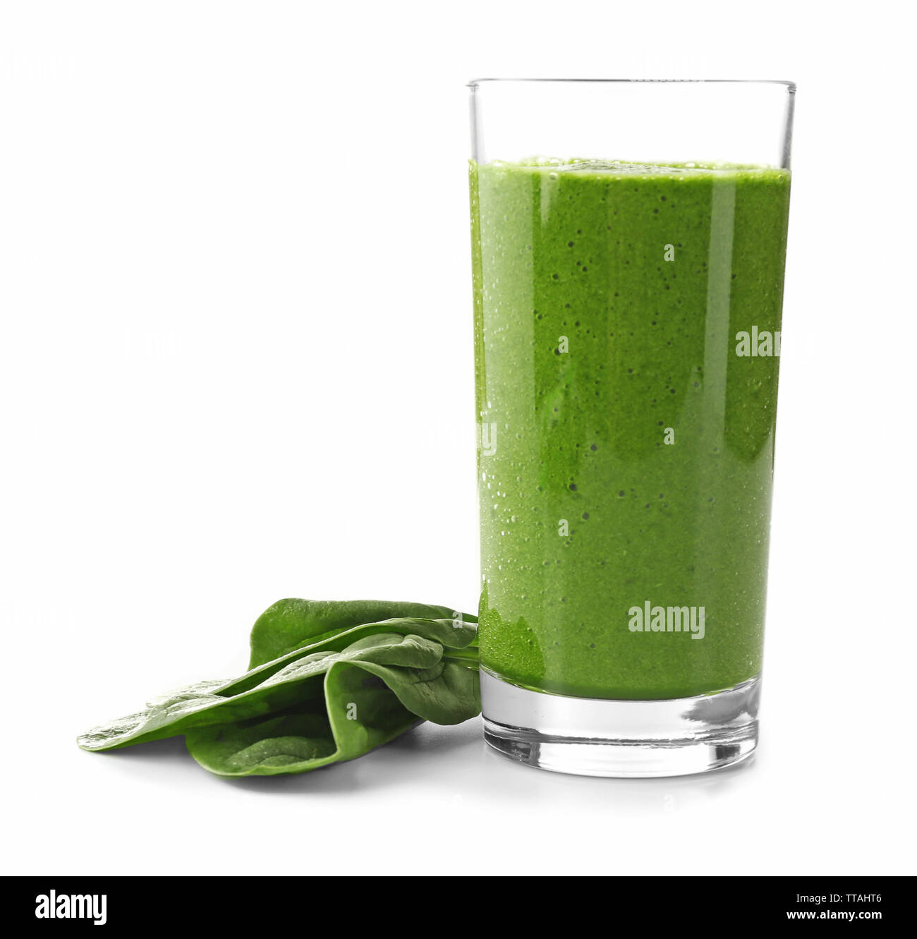 Glass of spinach juice isolated on white Stock Photo - Alamy