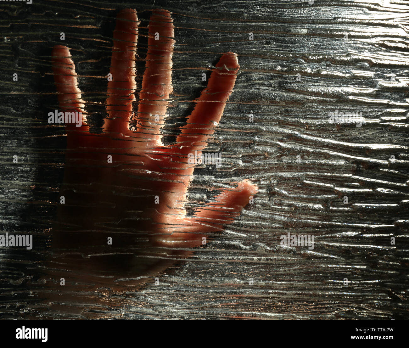 Female hand behind frosted glass, close-up Stock Photo - Alamy