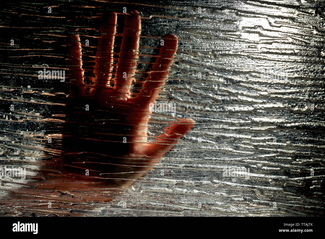 Female hand behind frosted glass, close-up Stock Photo - Alamy