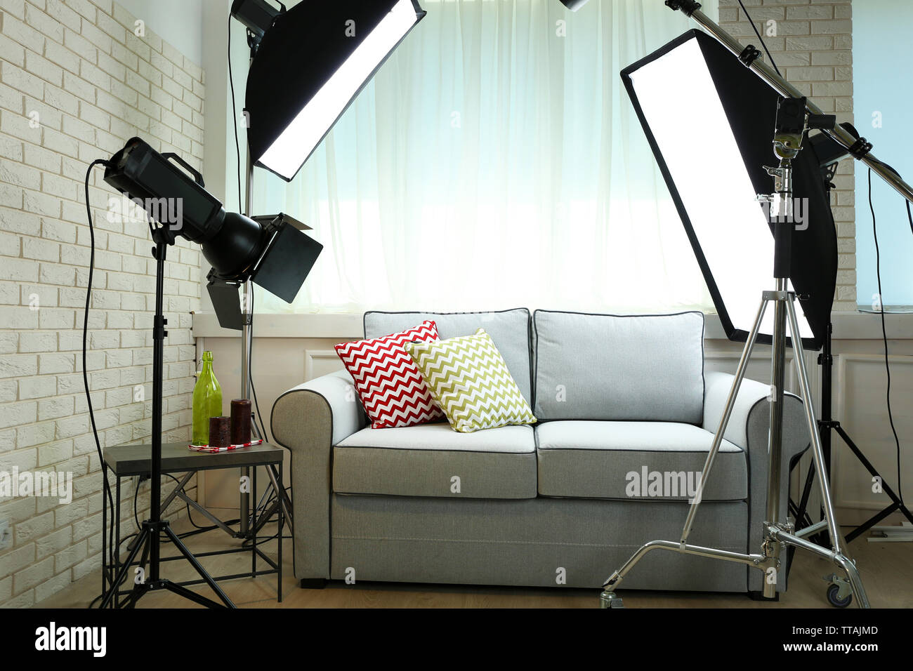 Photo studio with modern interior and lighting equipment Stock Photo ...