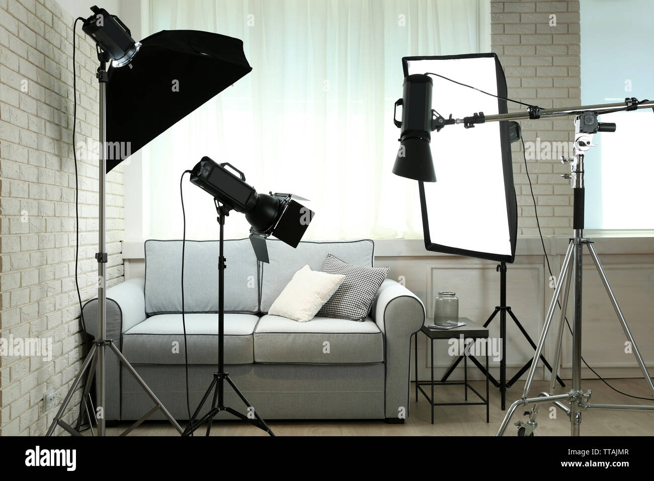Photo studio with modern interior and lighting equipment Stock Photo ...